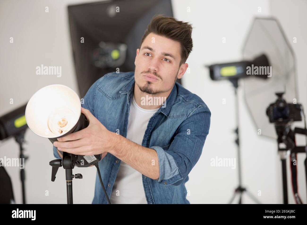 closeup view of professional photographer using a camera in studio ...