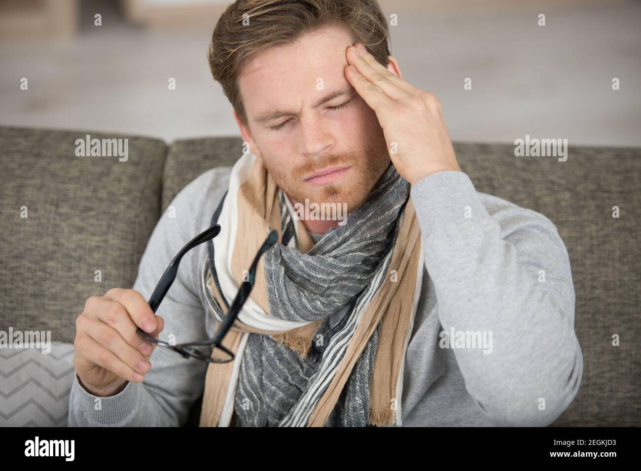 man with eyes pain on white background Stock Photo - Alamy