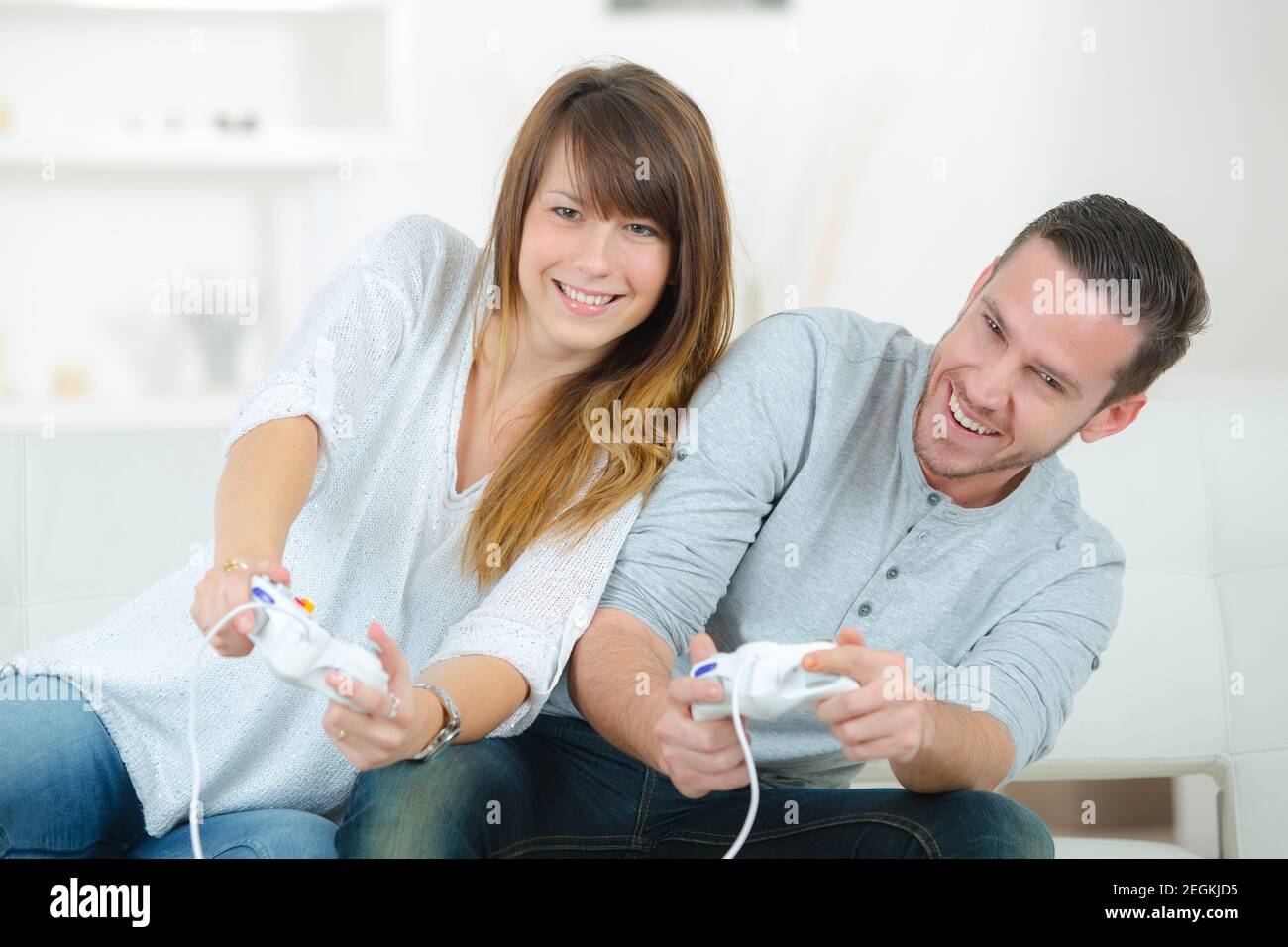 two friends are playing video games Stock Photo - Alamy