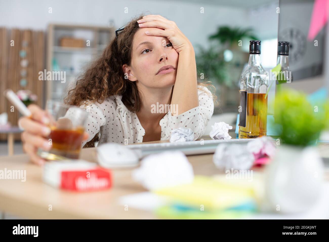 Hiding alcohol at work desk hi-res stock photography and images - Alamy