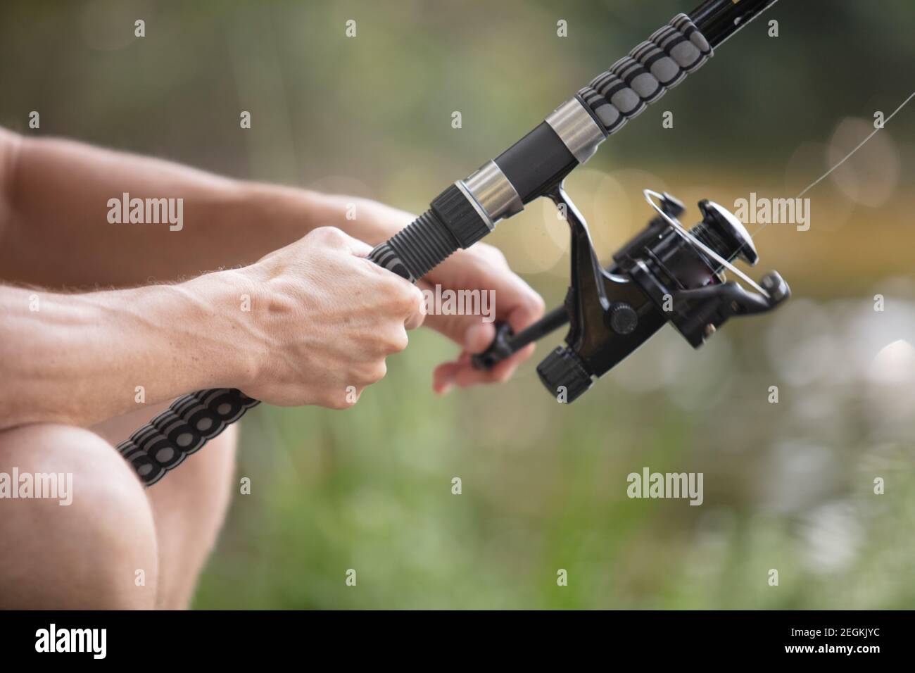 Hand on fishing pole hi-res stock photography and images - Alamy
