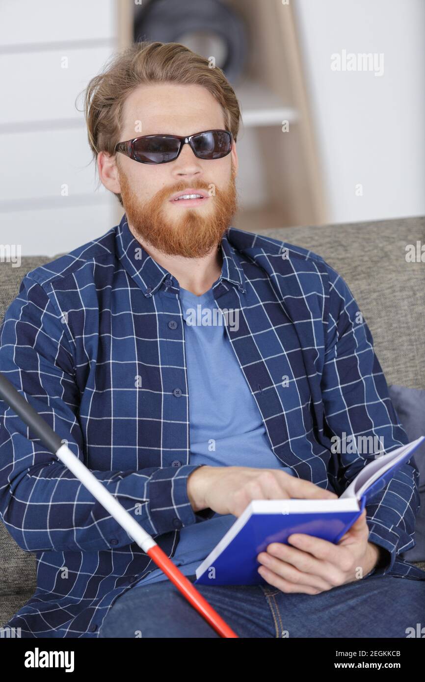 blind person reading a book written in braille alphabet Stock Photo - Alamy