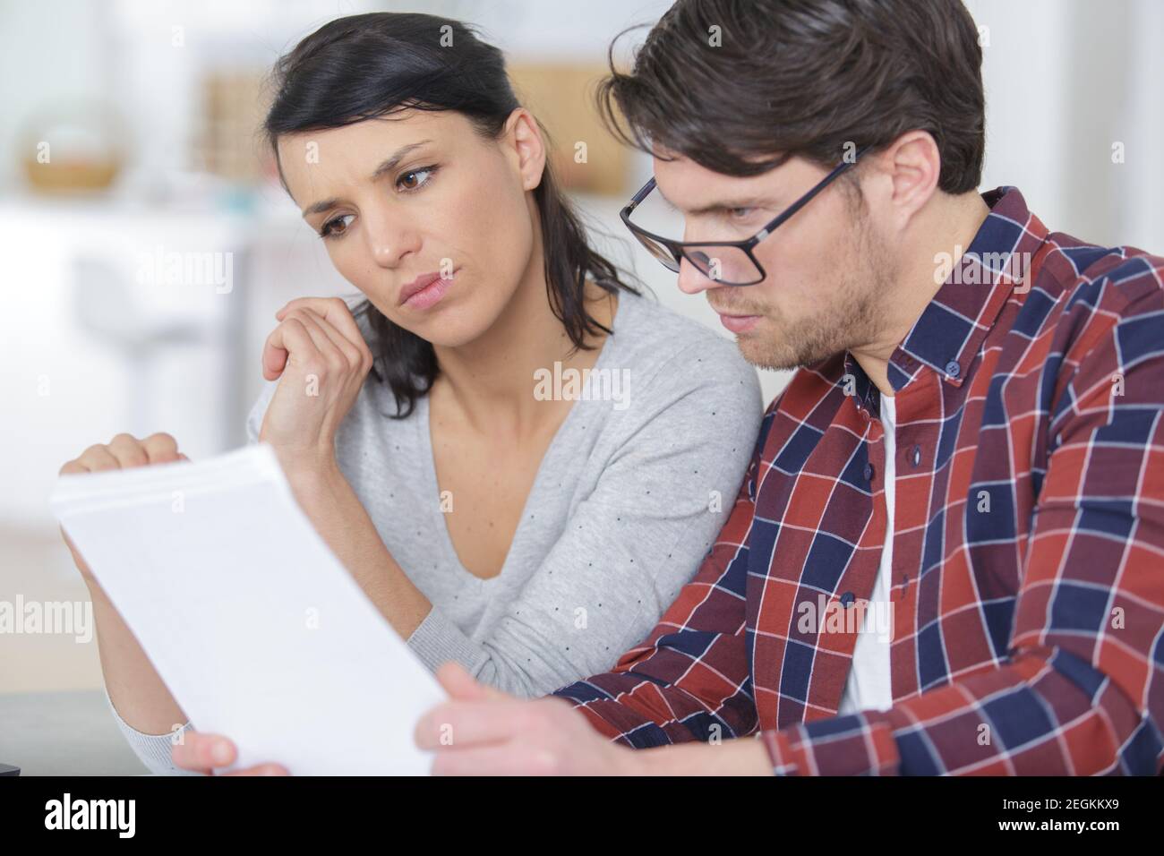 couple carefully reading a contract Stock Photo - Alamy