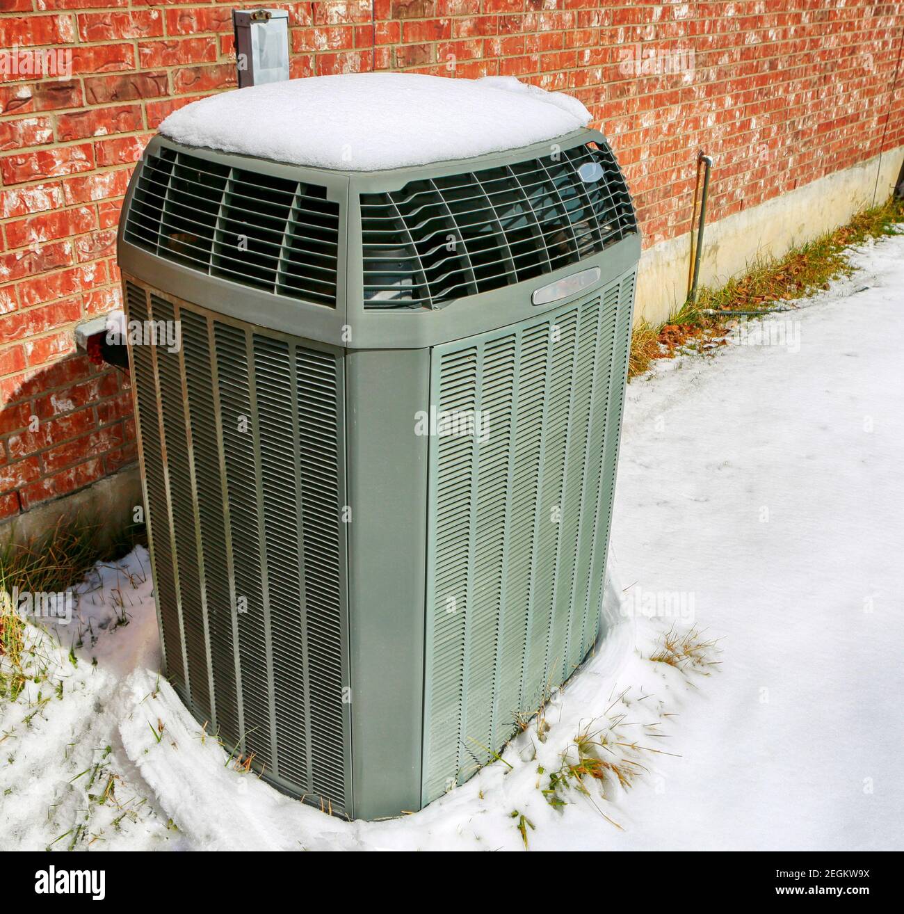 Modern high efficiency air conditioner under snow Stock Photo - Alamy