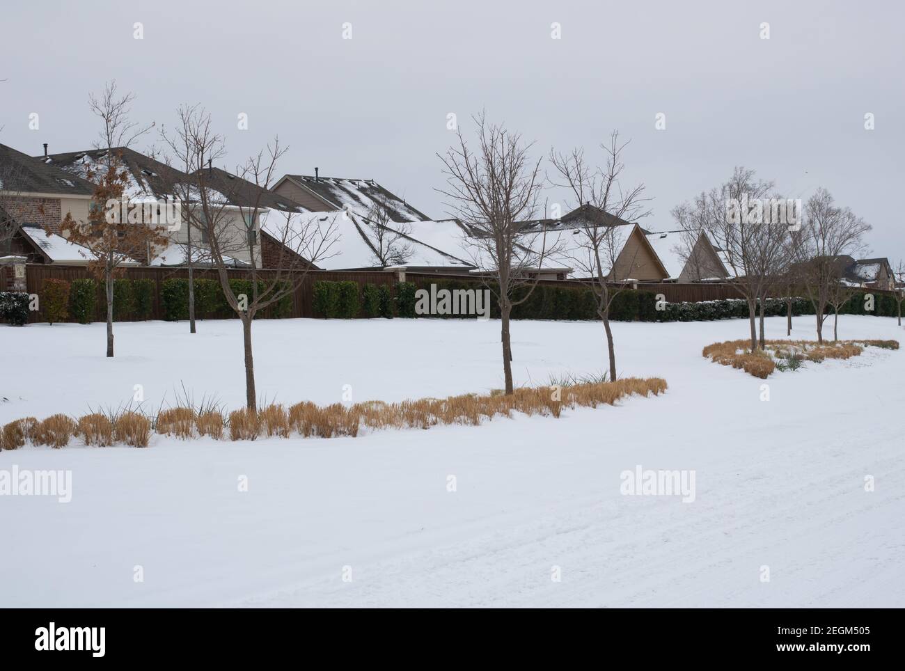 Roadside view of heavy snow covered the community road in Texas Stock ...