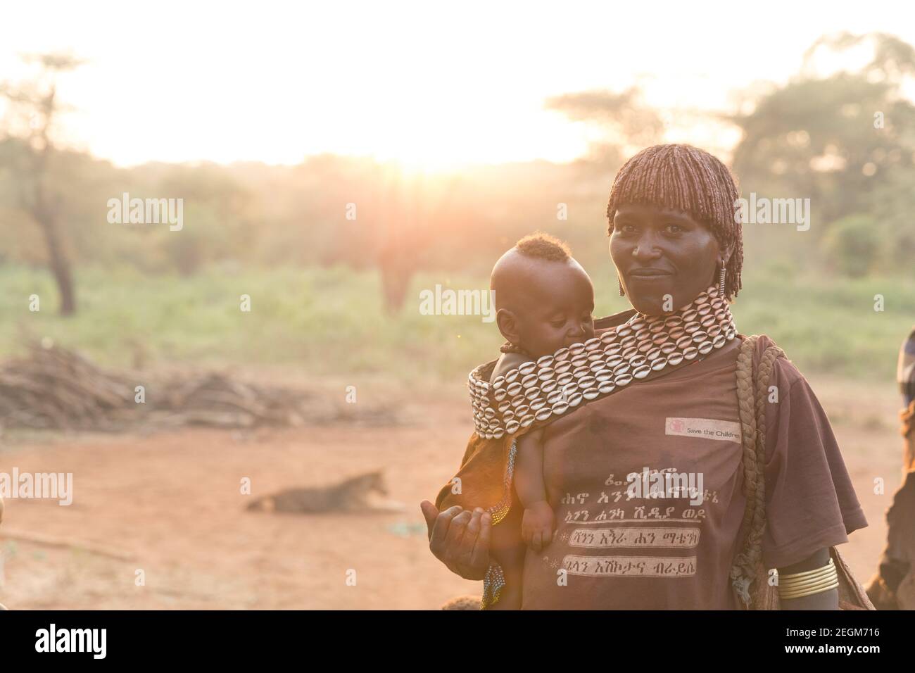 Portrait of woman and child from the Banna tribe attending a bull ...