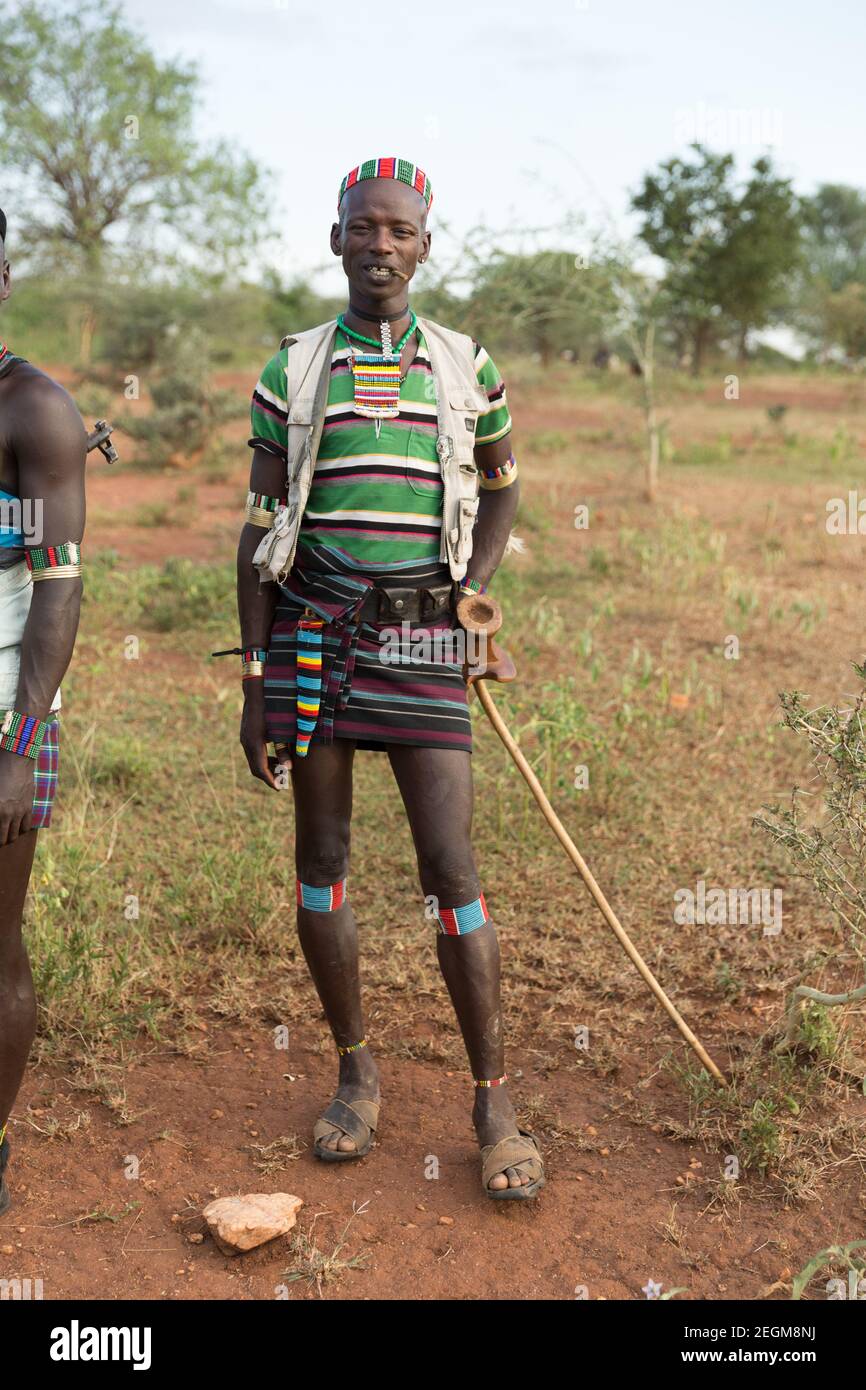 Portrait of man from the Banna tribe attending a bull jumping ceremony ...