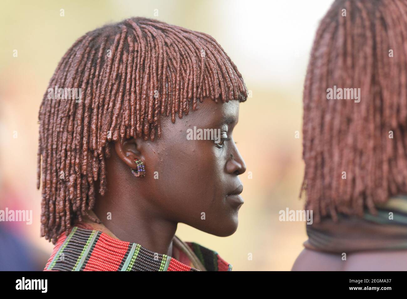 Portrait of a woman from the Banna tribe attending a bull jumping ...
