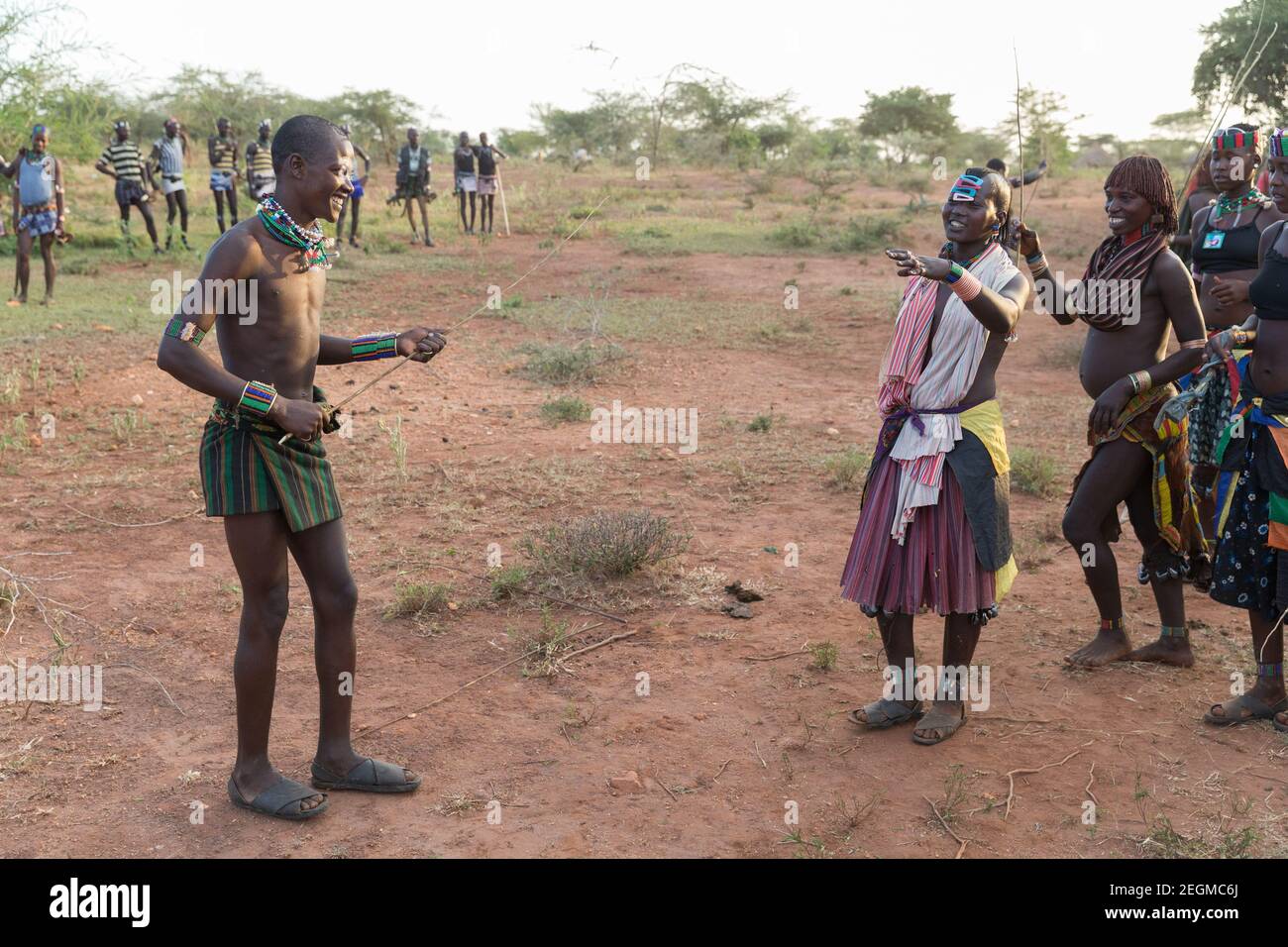 Women from the Banna tribe with the young man participating in the bull ...
