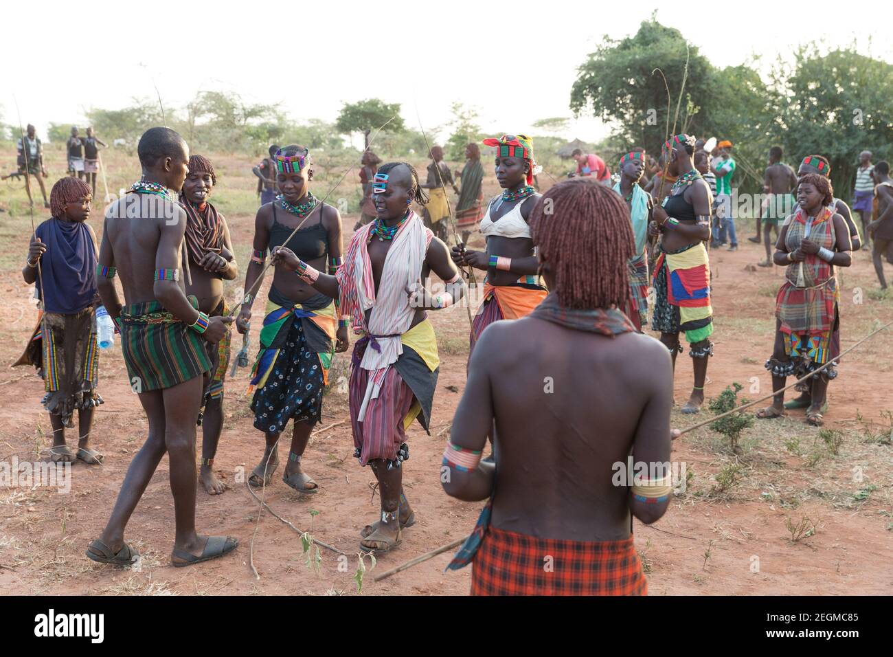 Women from the Banna tribe with the young man participating in the bull ...