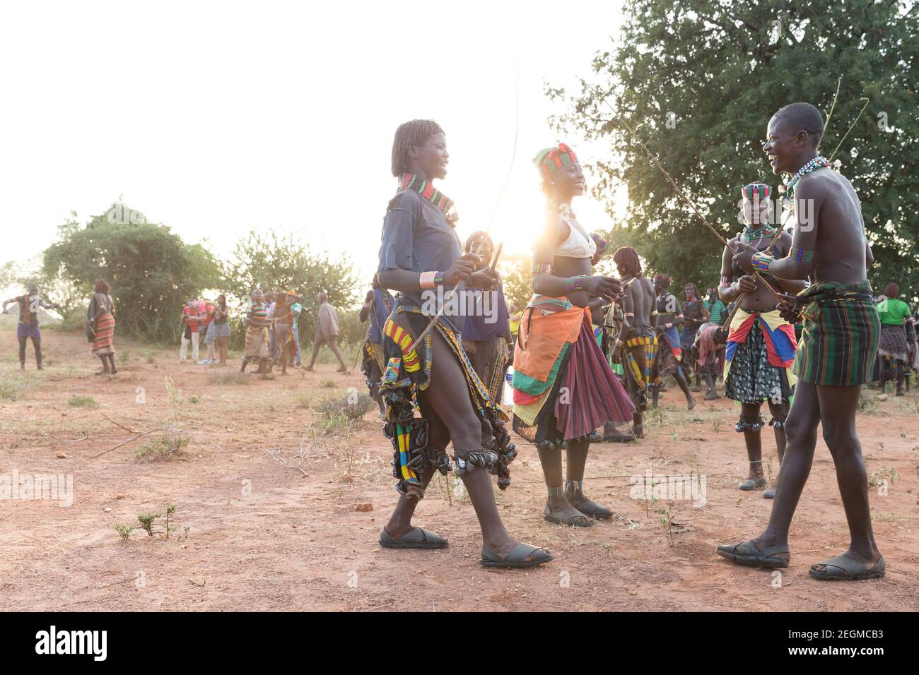 Women from the Banna tribe with the young man participating in the bull ...