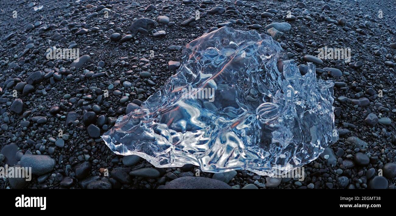 Ice rock colored by the sunrise at Diamond beach Iceland, small rocks ...