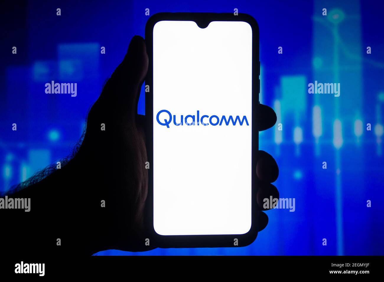 In this photo illustration the Qualcomm logo seen displayed on a ...