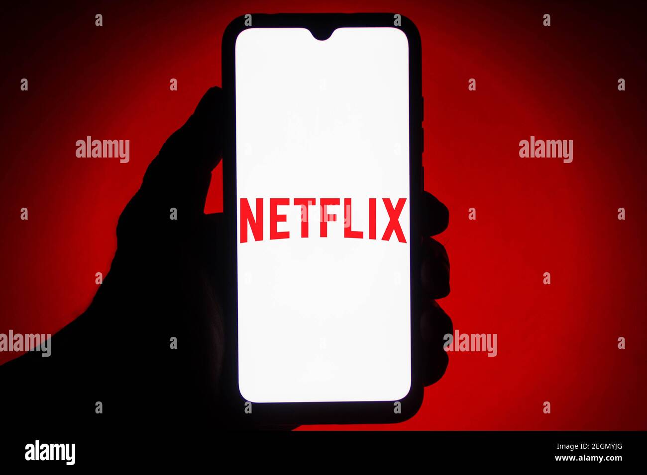 In this photo illustration the Netflix logo seen displayed on a ...