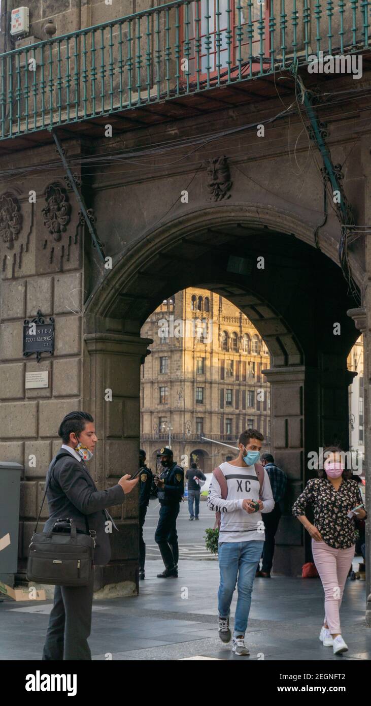 Hispanic people walking under a classic building from Mexico City Stock ...