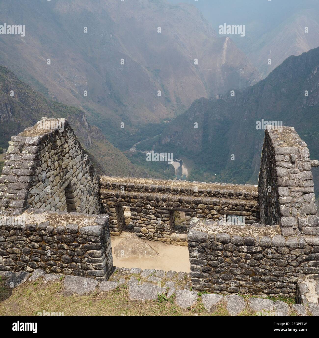 Ruins of an inca building at the top of Waynapicchu mountain, gray ...