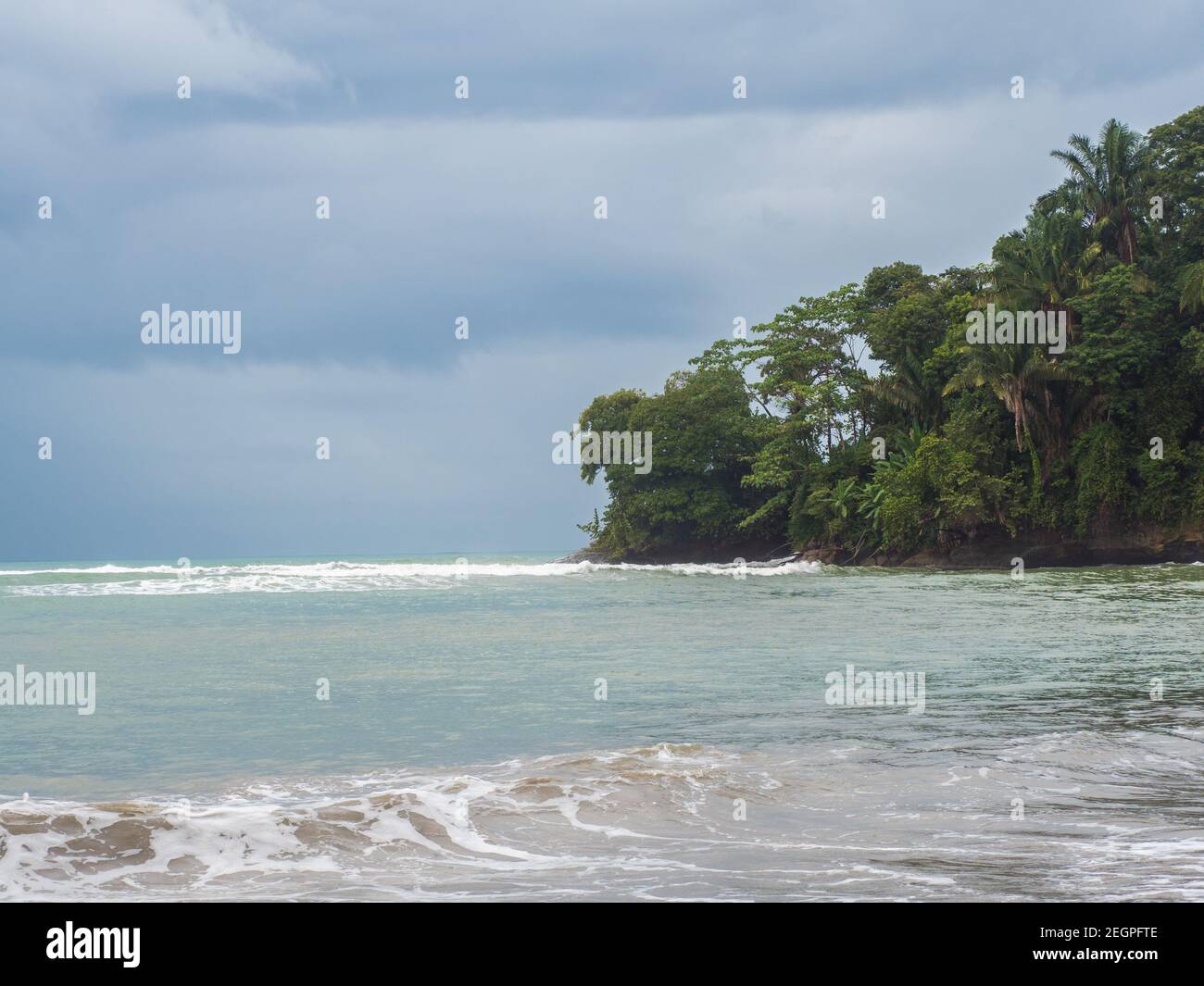 where the jungle meets the sea, turquoise waters and blue skies next to ...