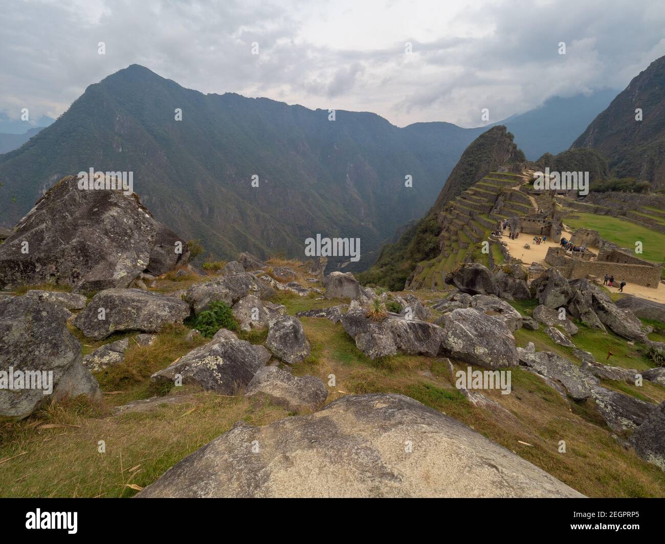 Machu Picchu quarry and inca terraces, mountain range on the background ...
