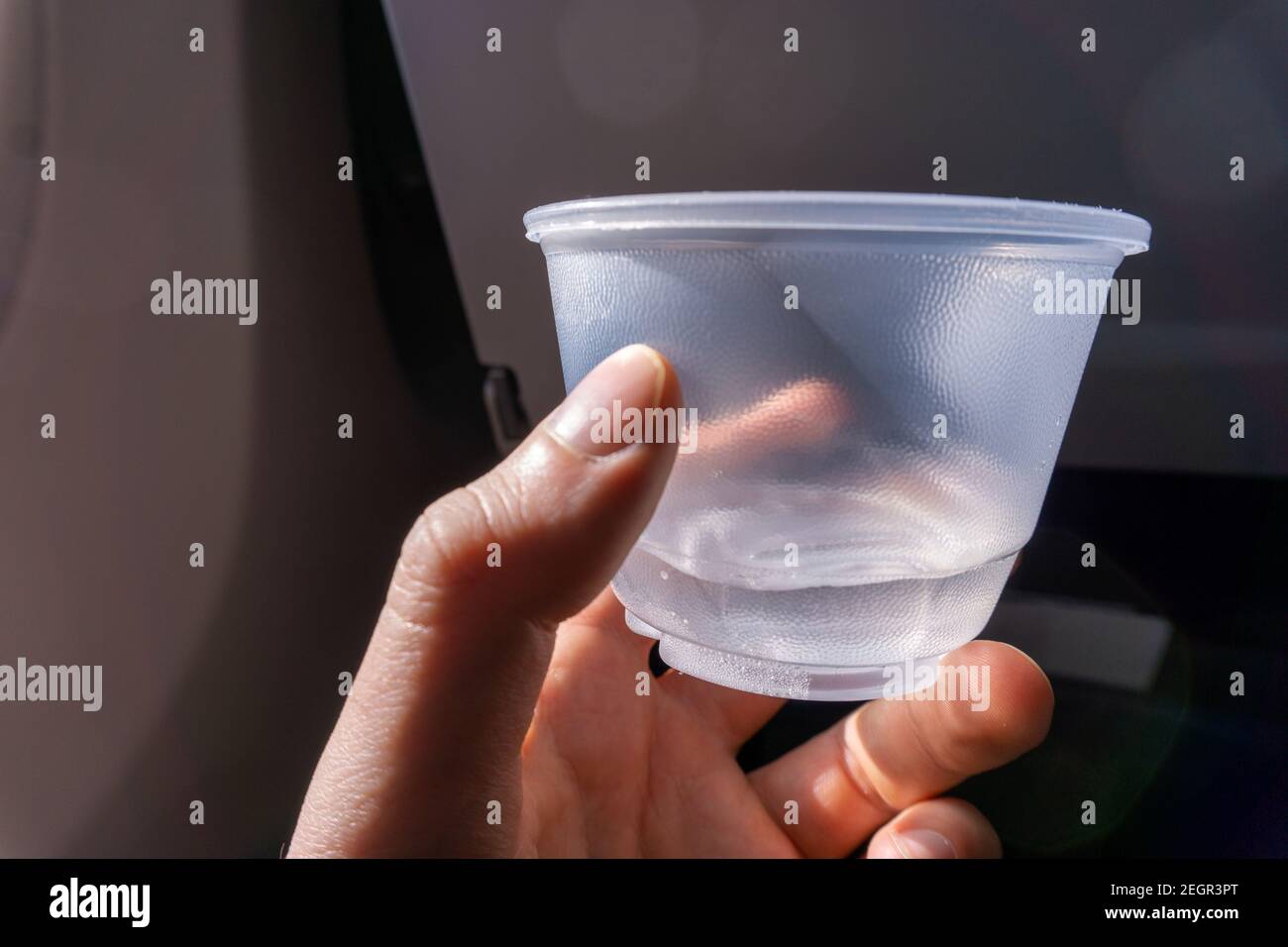 Close up cup of water on airplane Stock Photo - Alamy