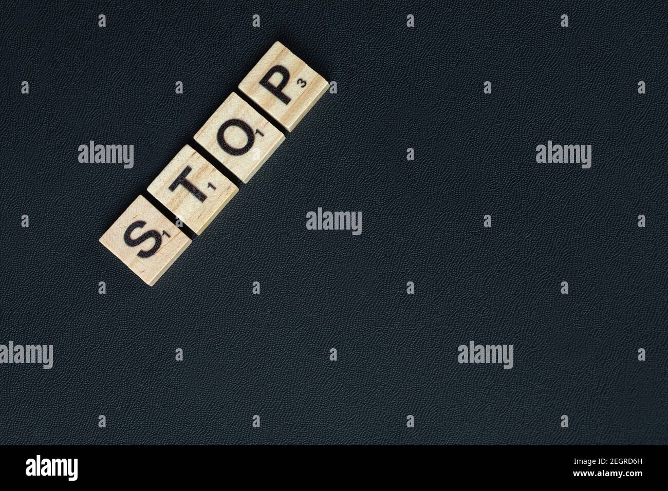 Stop symbolic writing with black letters on wooden dices in horizontal ...