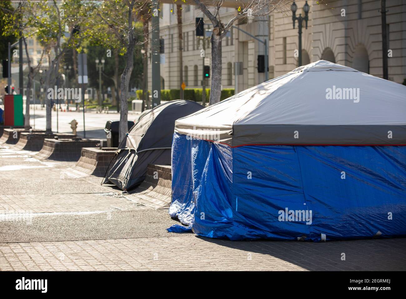A homeless encampment sits on a street in Downtown Los Angeles ...