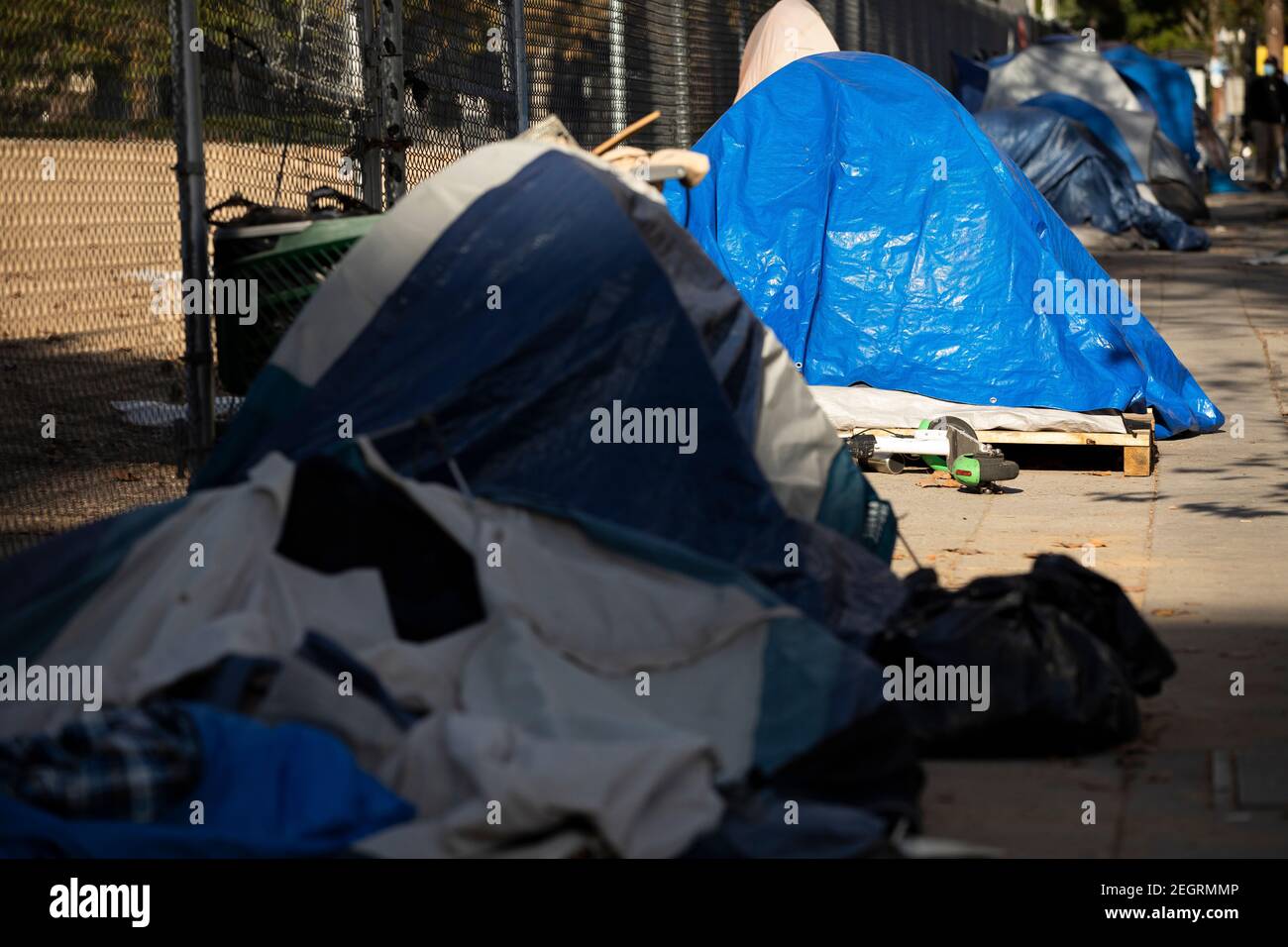 A homeless encampment sits on a street in Downtown Los Angeles ...