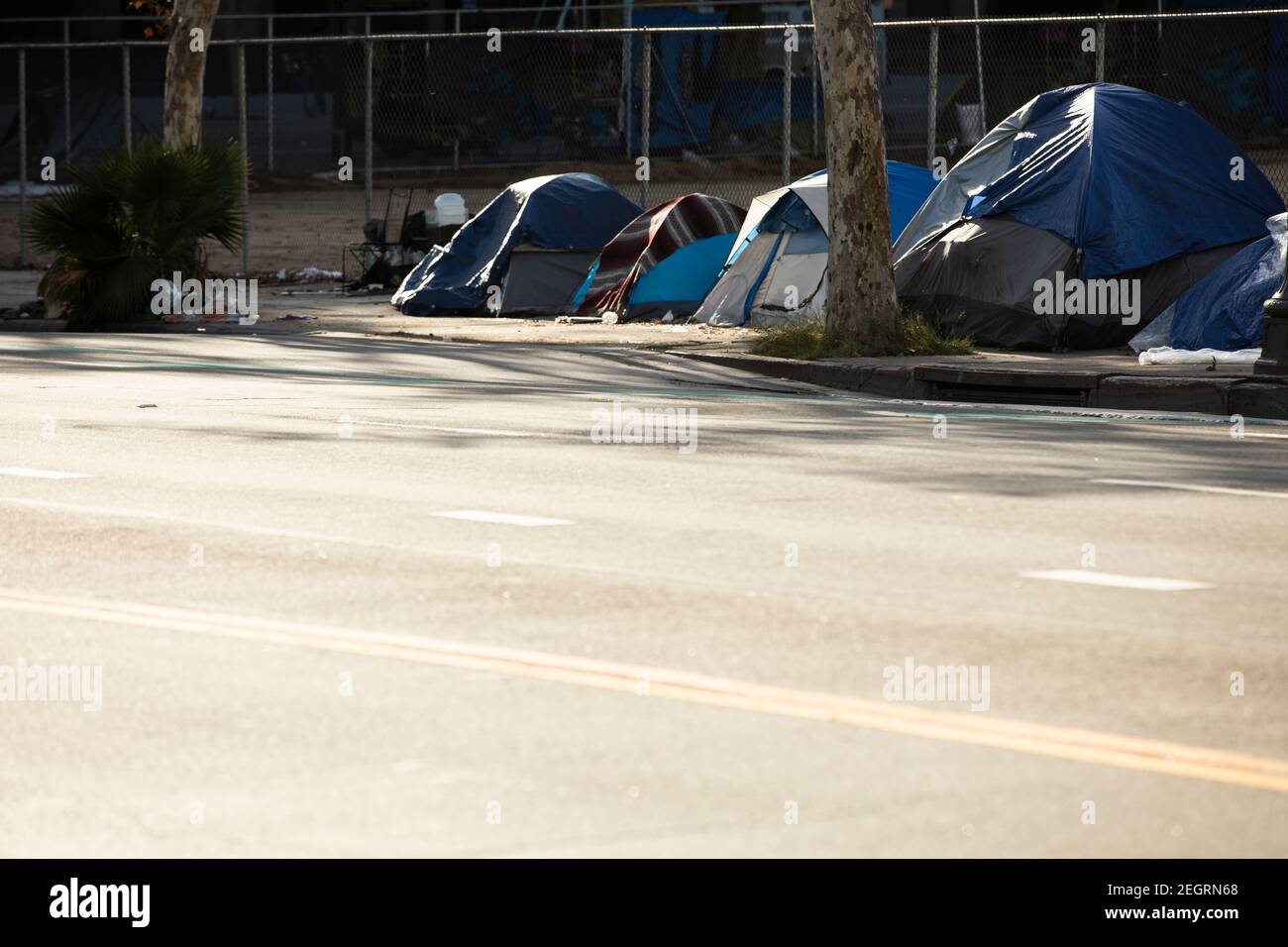 A homeless encampment sits on a street in Downtown Los Angeles ...