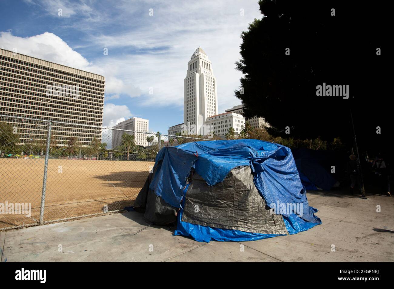 A homeless encampment sits on a street in Downtown Los Angeles ...