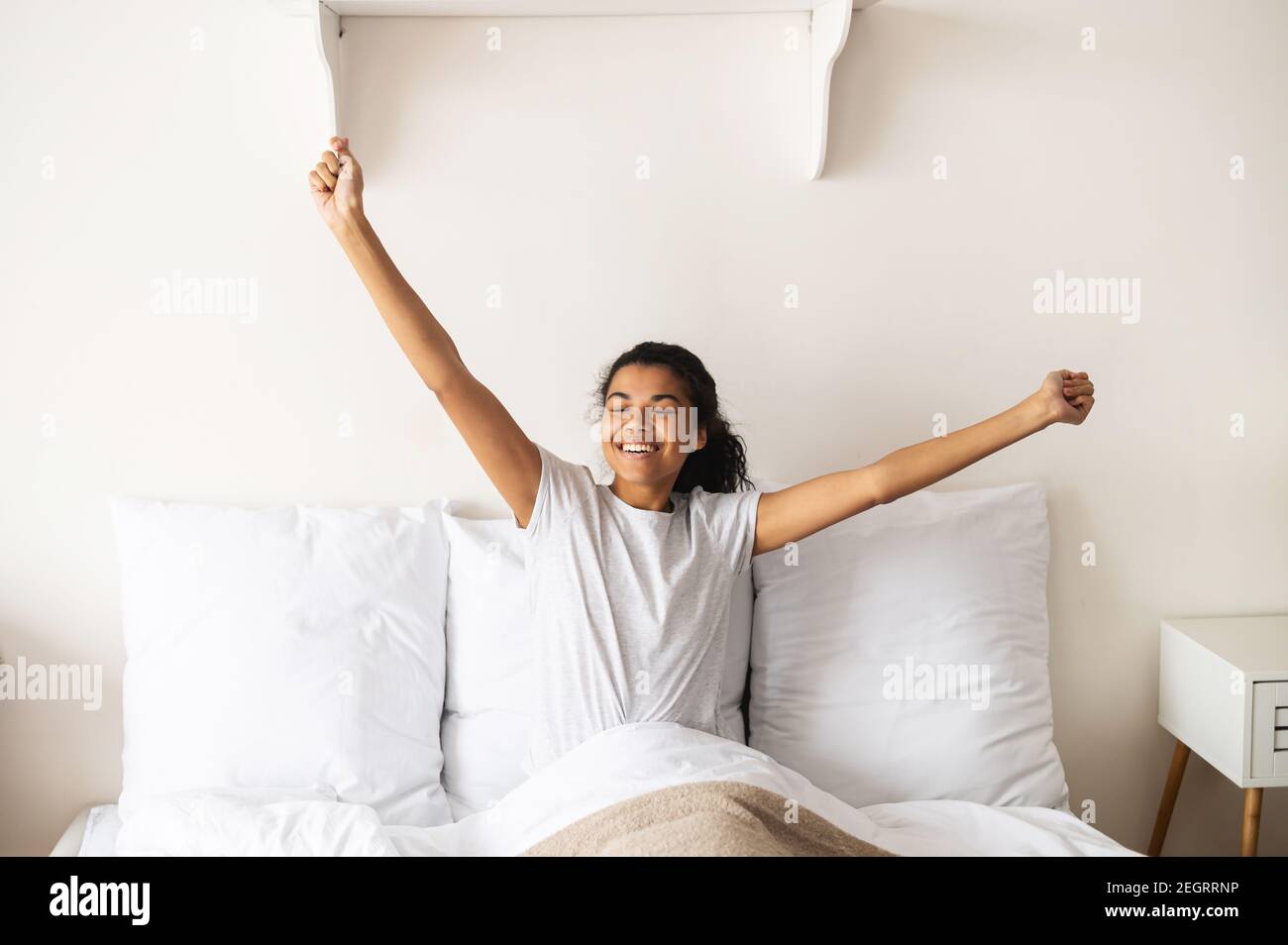 African american girl waking up in bed hi-res stock photography and ...