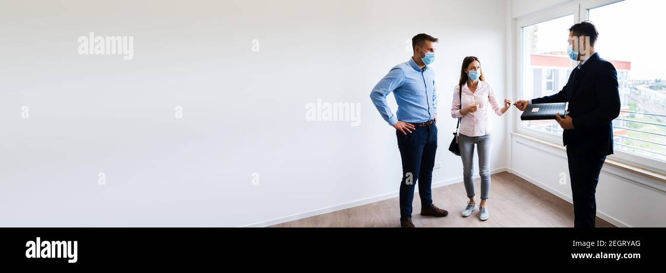 Realtor Showing New Real Estate House In Face Mask Stock Photo - Alamy
