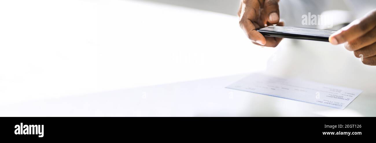 Remote Check Deposit Taking Photo With Mobile Phone Stock Photo - Alamy