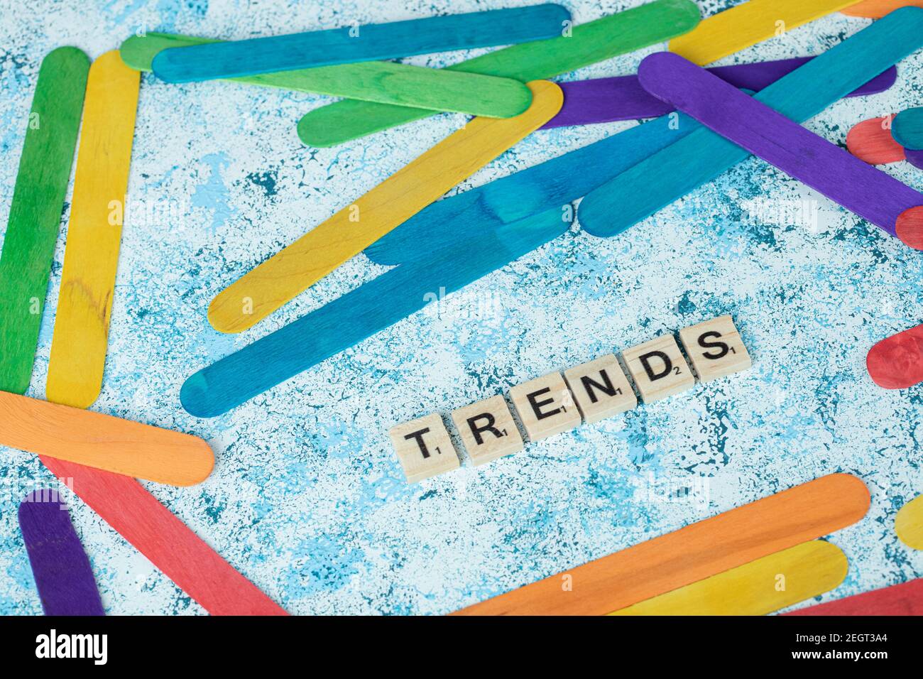 Trends writing with black letters on wooden dices on the blue ...