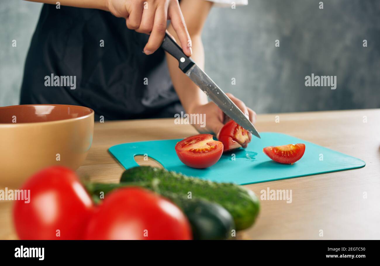 Slicing fresh vegetables cutting table food preparation kitchen healthy ...