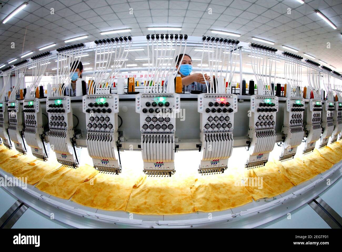 Beijing, China's Shandong Province. 18th Feb, 2021. Embroidery workers ...
