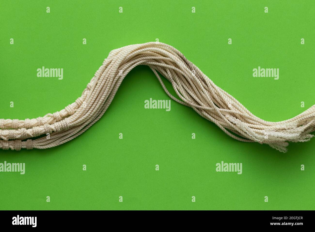 Tallit threads made of sheep wool, green background Stock Photo - Alamy