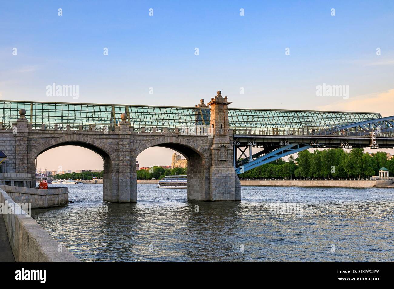 A large powerful bridge over the river, the top of the space is covered ...