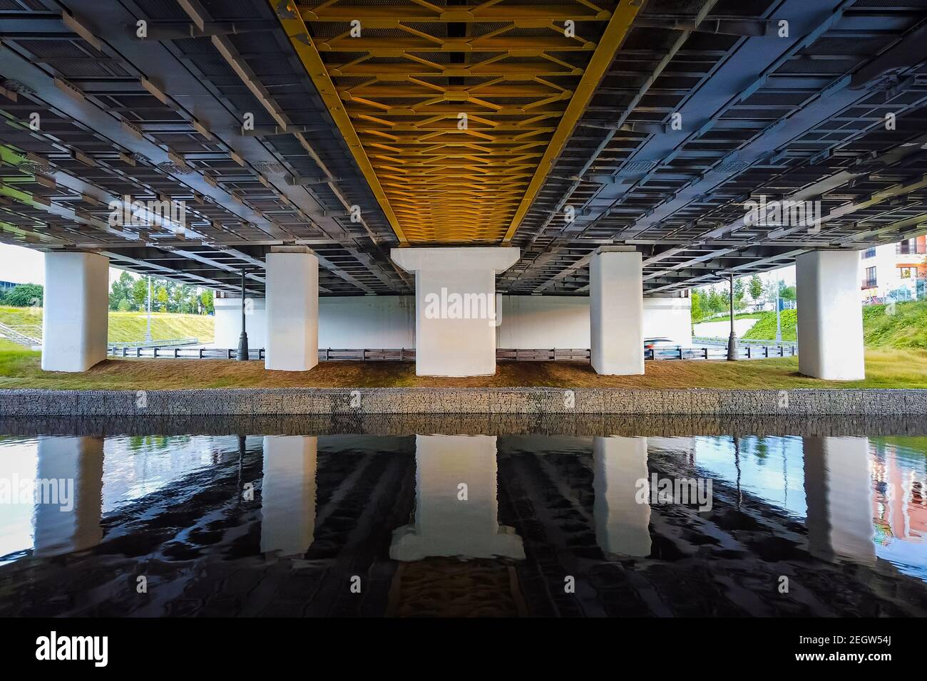 Powerful iron bridge structure, View from below. Concrete pillars, big ...