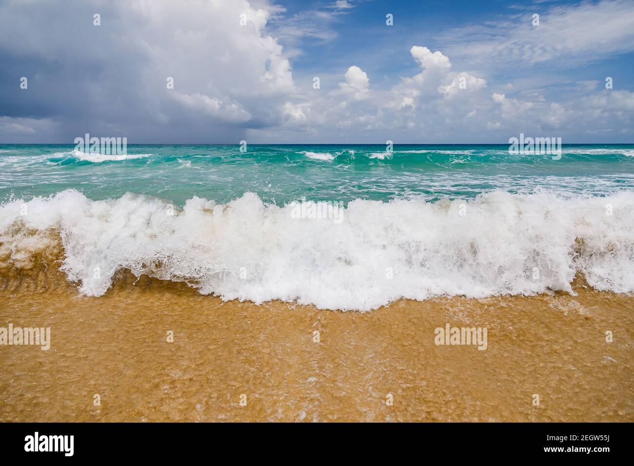 Powerful, stormy, foamy waves are picked up by the wind. White foam ...