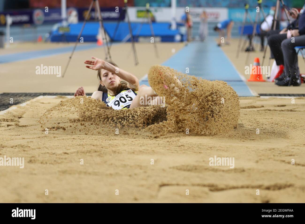 ISTANBUL, TURKEY - FEBRUARY 06, 2021: Undefined athlete long jumping ...