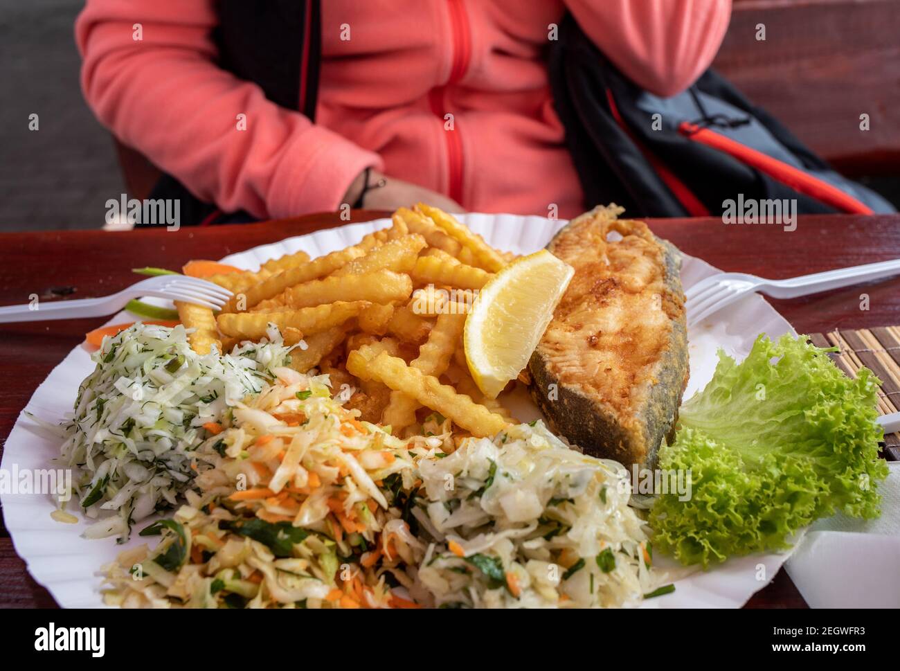 Fried fish with fries and vegetable salad Stock Photo - Alamy
