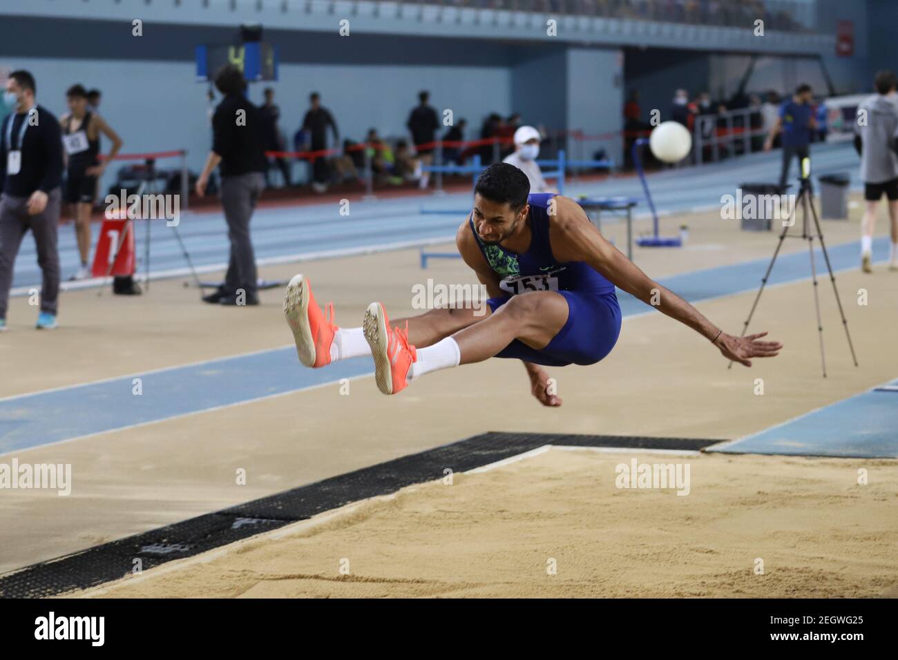 ISTANBUL, TURKEY - FEBRUARY 06, 2021: Undefined athlete long jumping ...