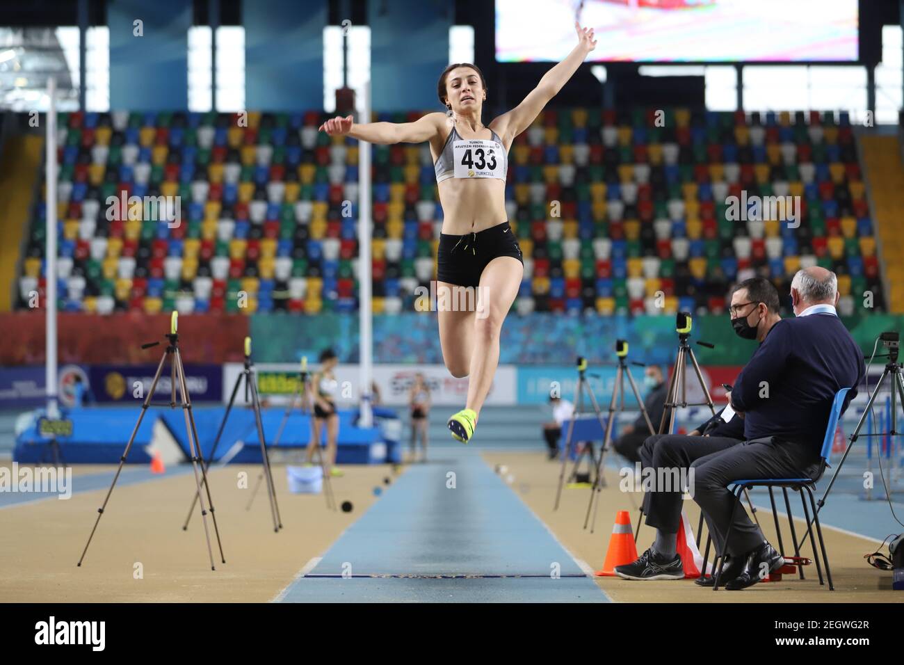 ISTANBUL, TURKEY - FEBRUARY 06, 2021: Undefined athlete long jumping ...