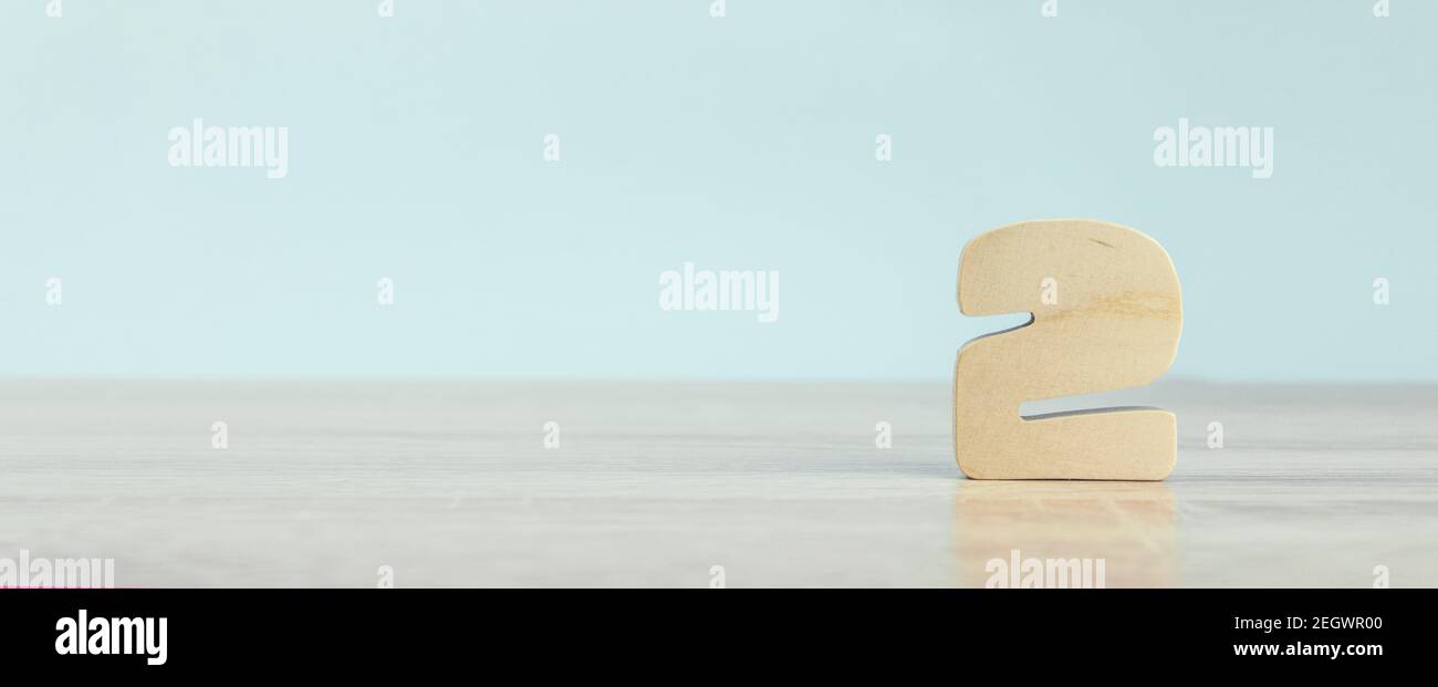 Wood Number 2 Two On Table. Close-Up. Copy space Stock Photo - Alamy