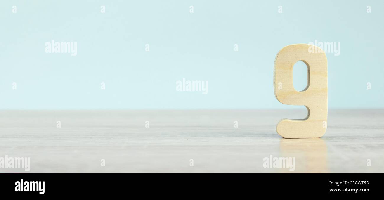 Wood Number 9 Nine On Table. Close-Up. Copy space Stock Photo - Alamy