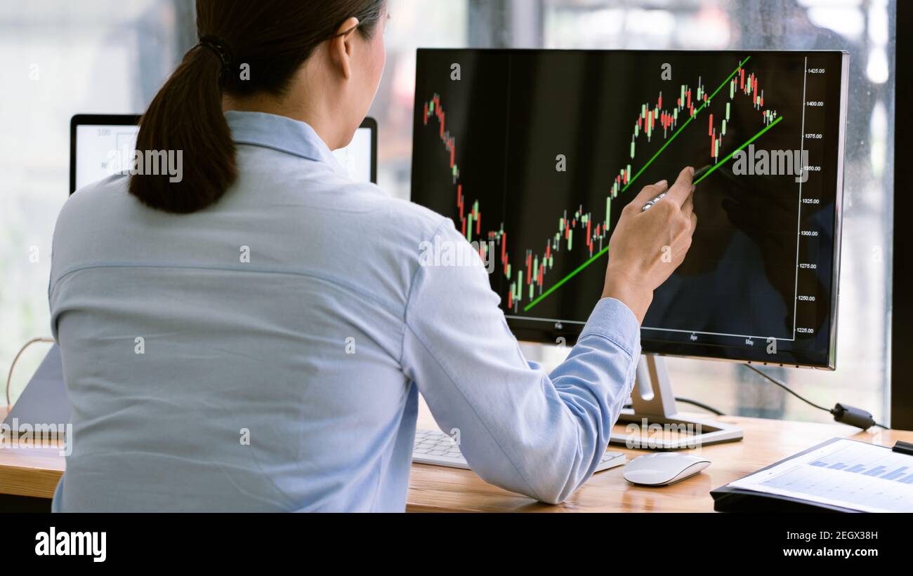 stock exchange trader working with graphs,diagrams on monitor in modern ...