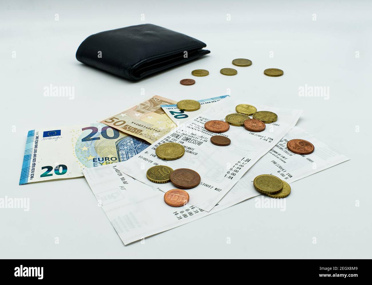 Euro banknotes, Euro coins and receipts isolated on white background ...