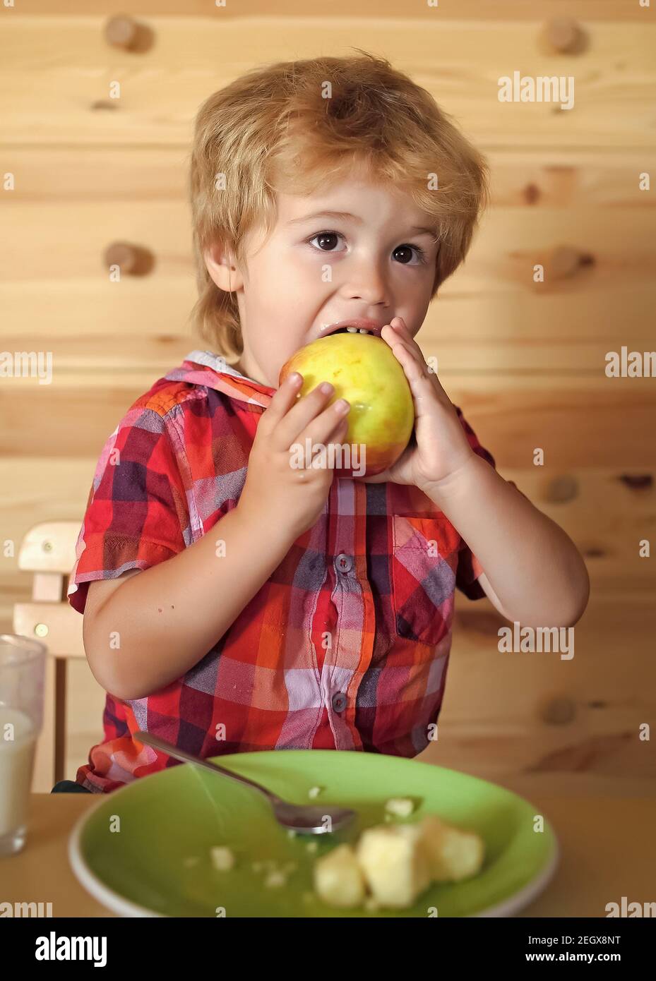 Small child eat apple. Healthy kids food and vitamin. Breakfast ...