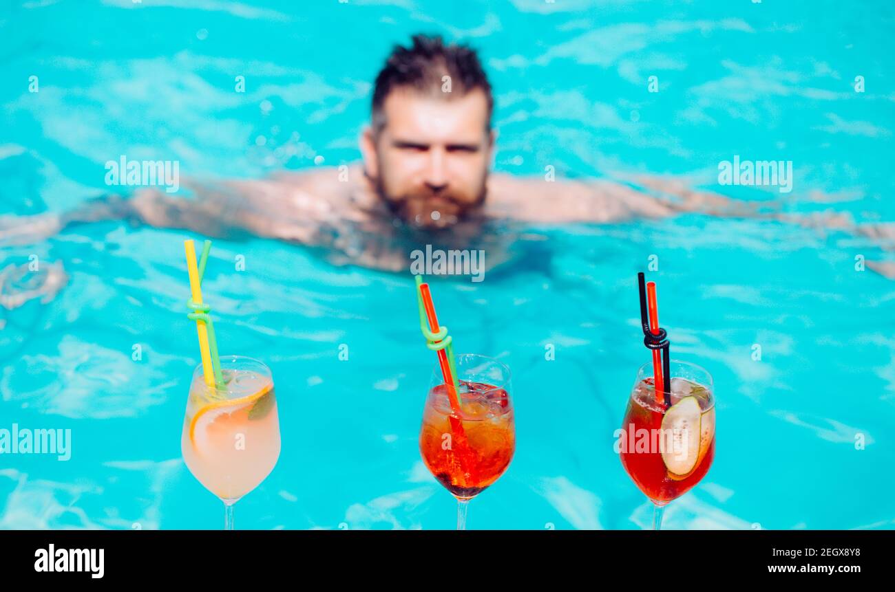 Cocktail at the pool. Summer holiday. Relaxing on the beach with ...