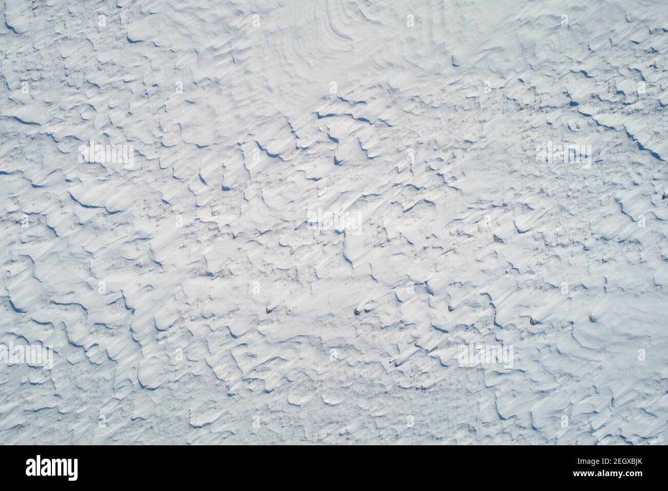 Frost icy snow field above drone top view. Covered with snow flat earth ...