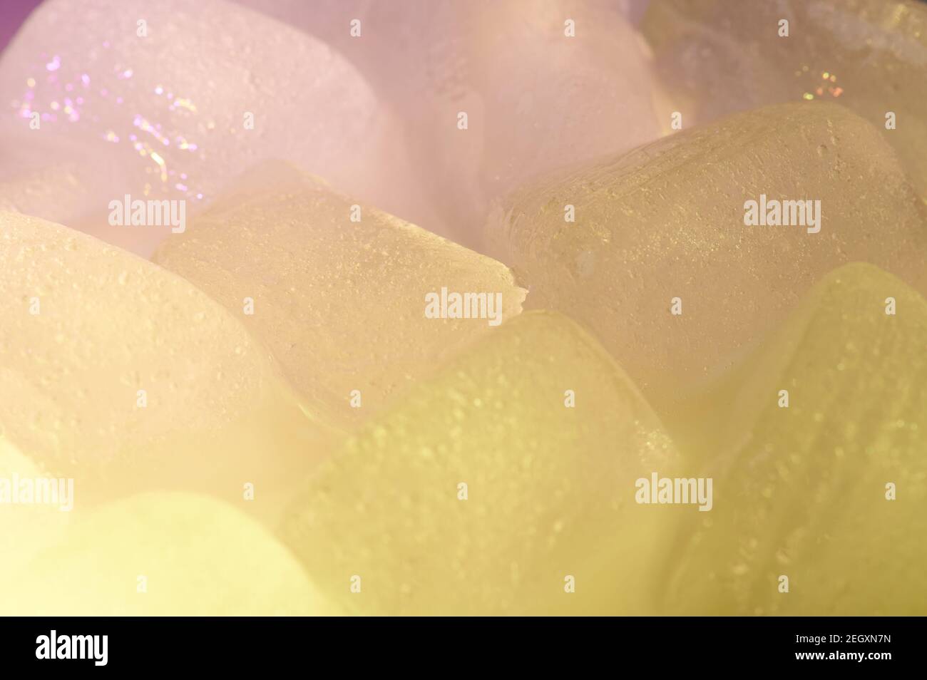 Abstract yellow ice cubes background close up view Stock Photo - Alamy